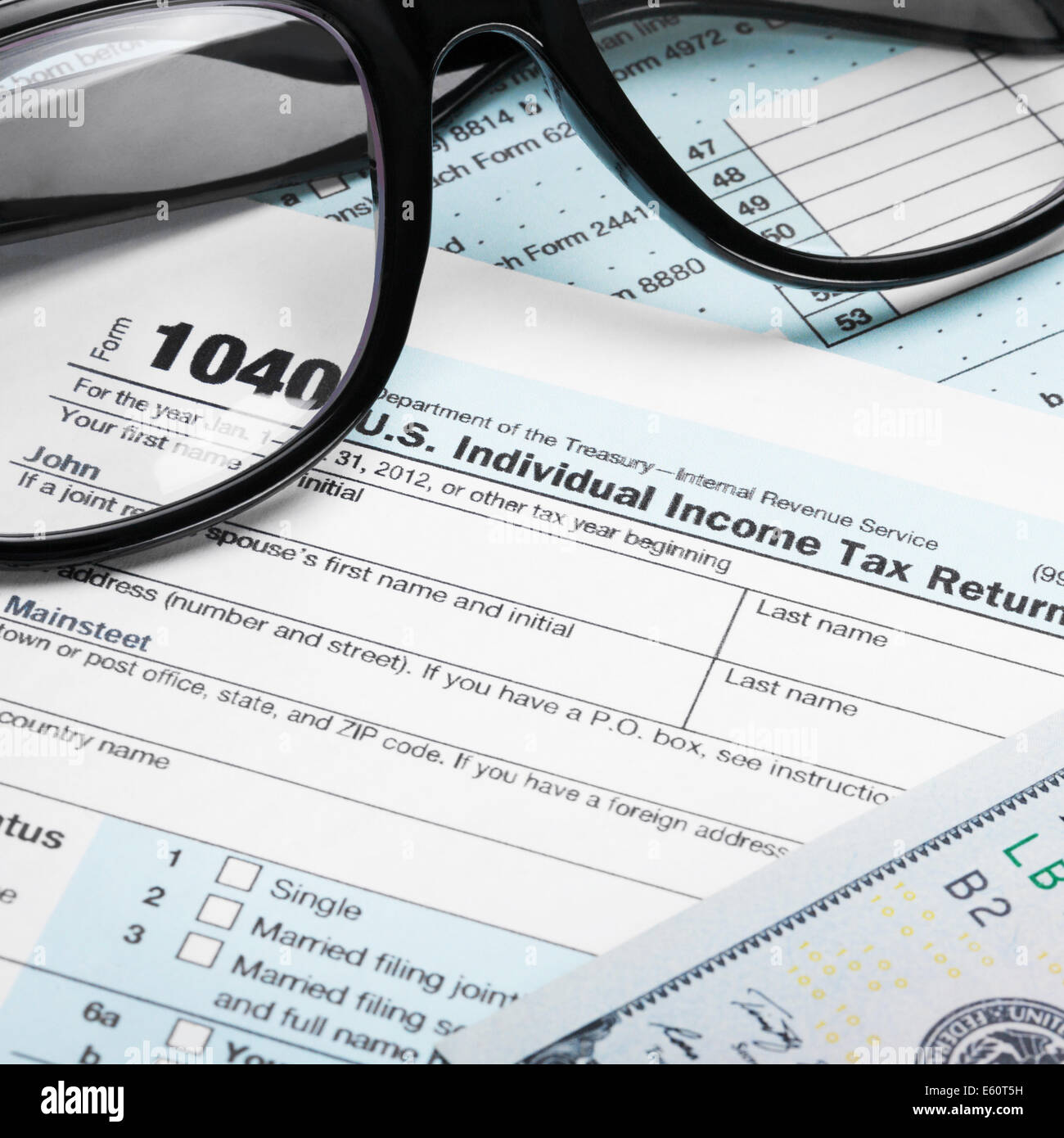 USA Tax Form 1040 with glasses and 100 US dollar bills Stock Photo - Alamy