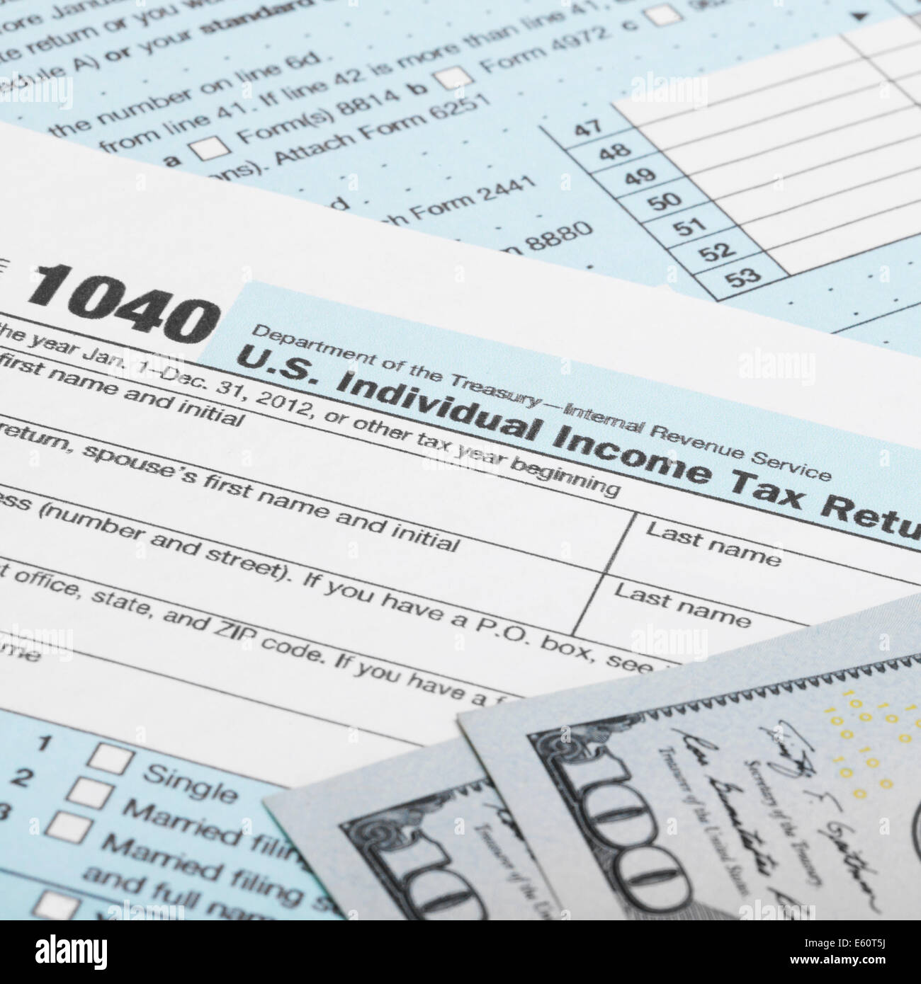 USA 1040 Tax Form with two 100 US dollar bills Stock Photo - Alamy