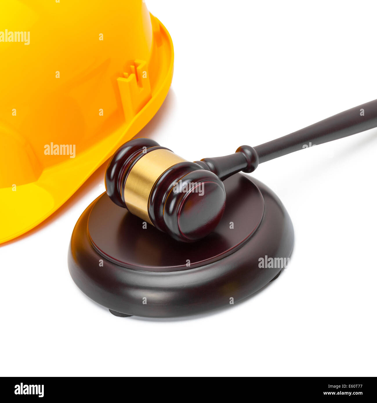 Wooden judge gavel and yellow color protective helmet - studio shoot ...