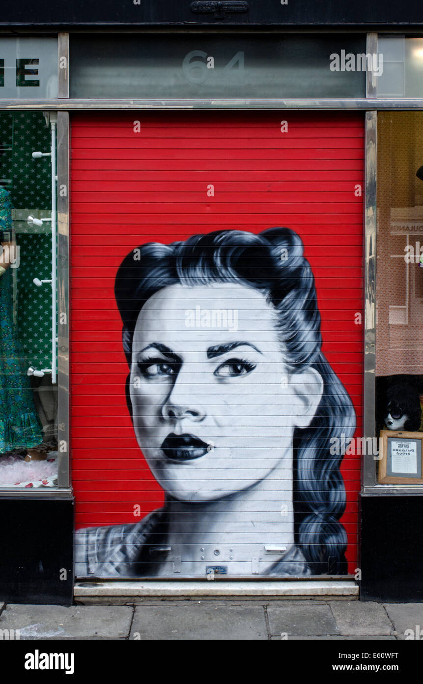 Retro style graffiti on the shutters of a branch of Armstrongs Vintage ...