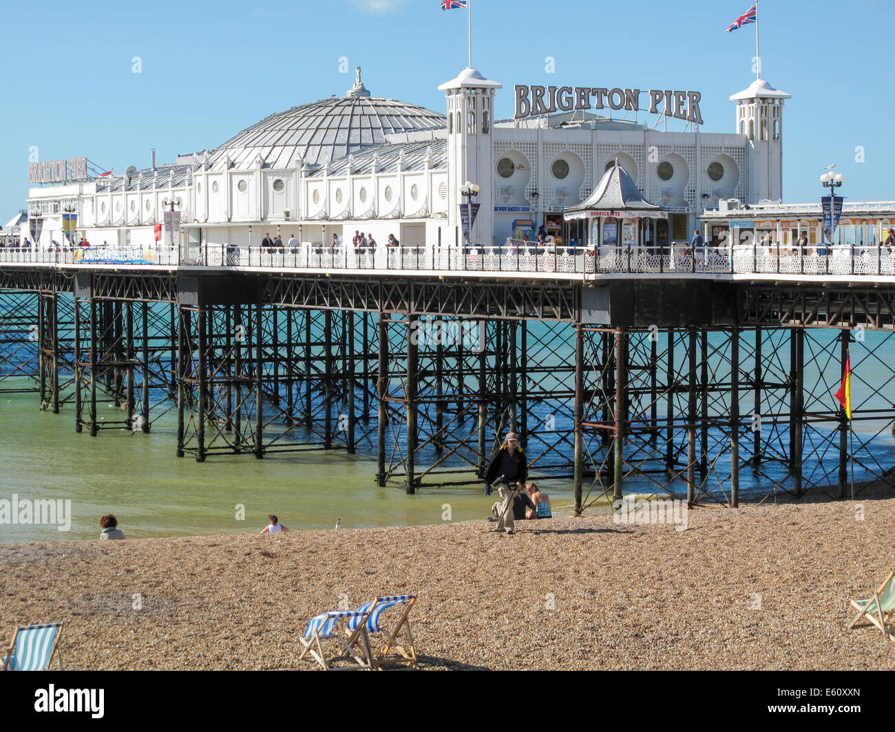 Brighton Pier and Brighton beach on a sunny summer afternoon with a ...