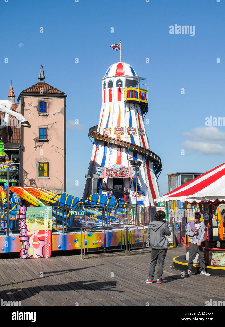 Helter skelter and colourful fairground attractions at the funfair on ...