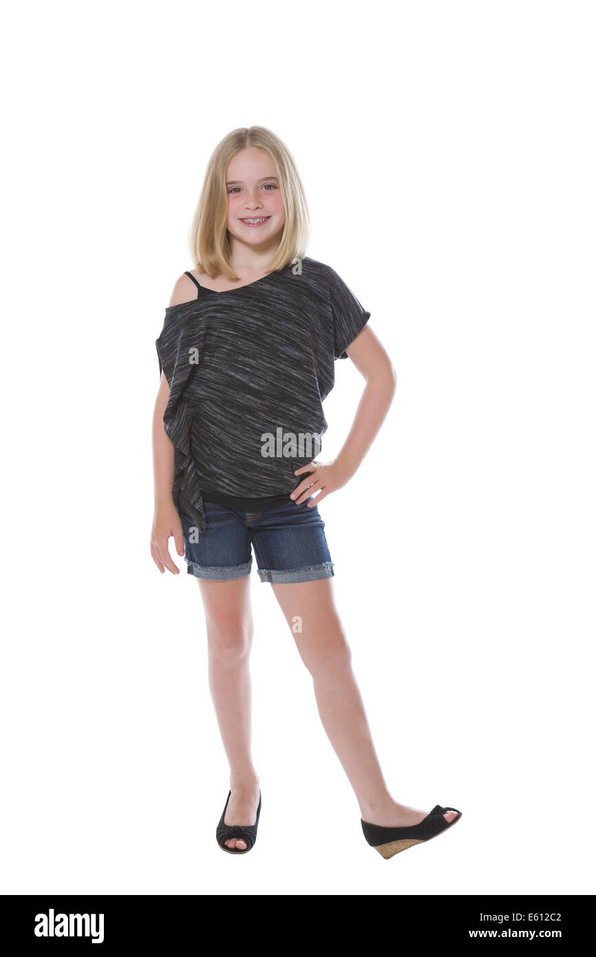 Full body front view of a pretty young girl, looking forward, isolated ...