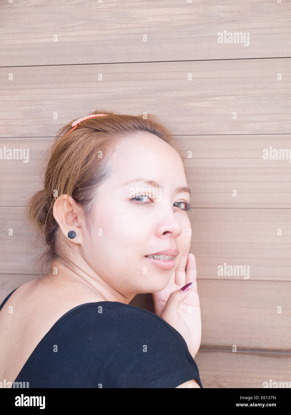 young Asian lady looking on something in nature Stock Photo - Alamy