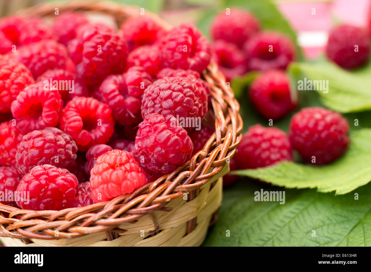 Sweet Organic Raspberries in a Wicker Basket Stock Photo - Alamy