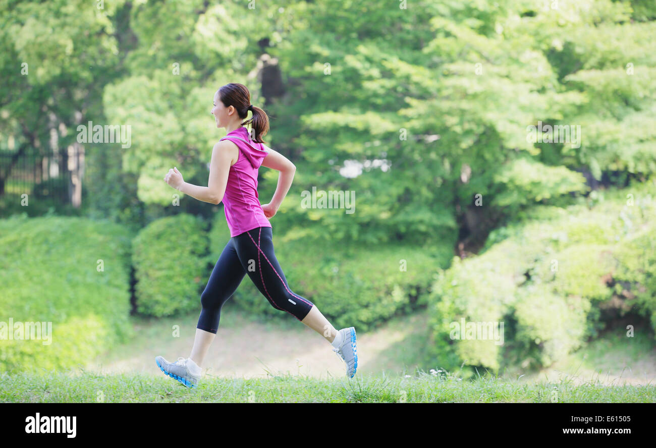 Young Japanese girl running in the park Stock Photo - Alamy