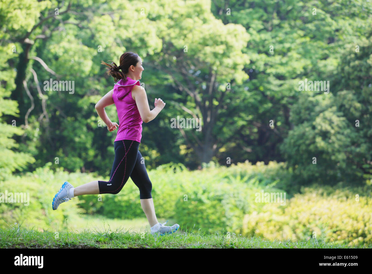 Young Japanese girl running in the park Stock Photo - Alamy