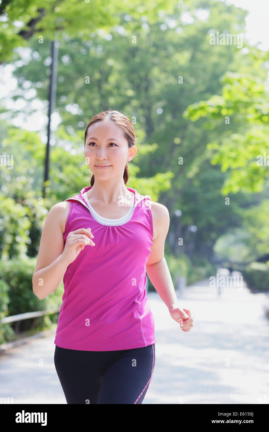 Young Japanese girl running in the park Stock Photo - Alamy
