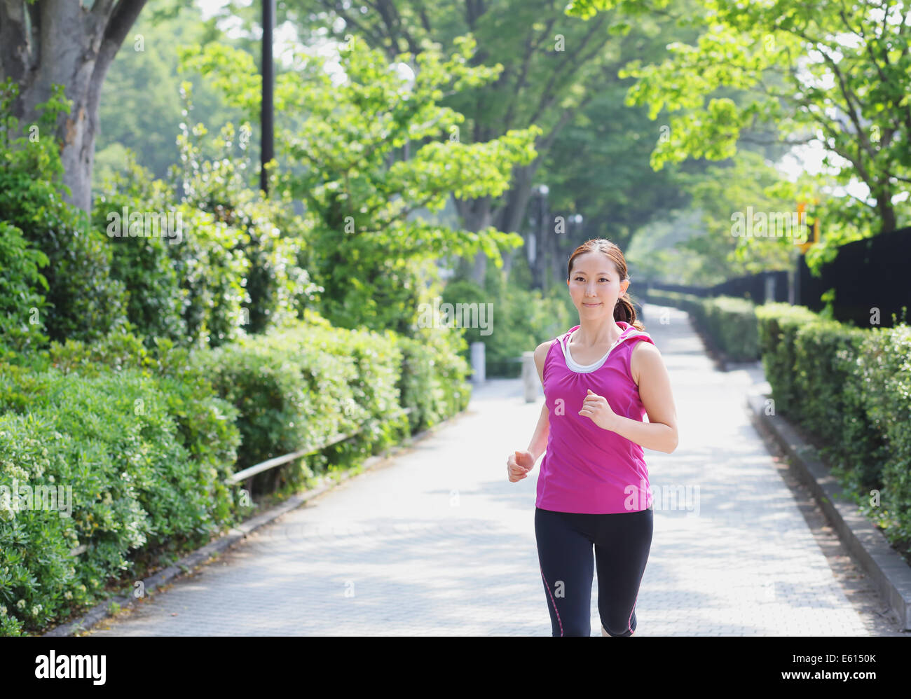 Young Japanese girl running in the park Stock Photo - Alamy