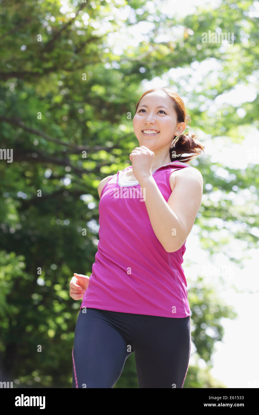 Young Japanese girl running in the park Stock Photo - Alamy