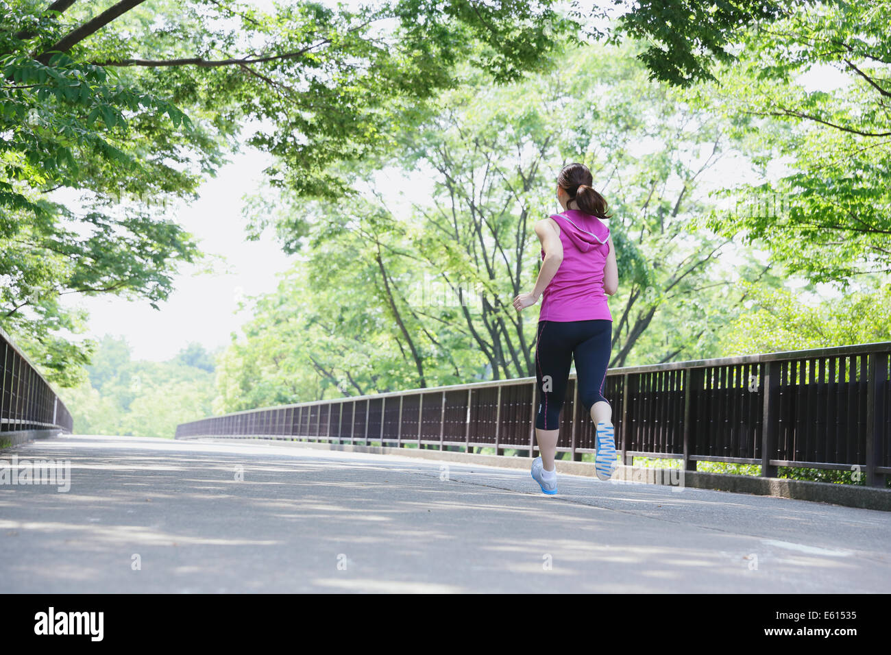 Young Japanese girl running in the park Stock Photo - Alamy