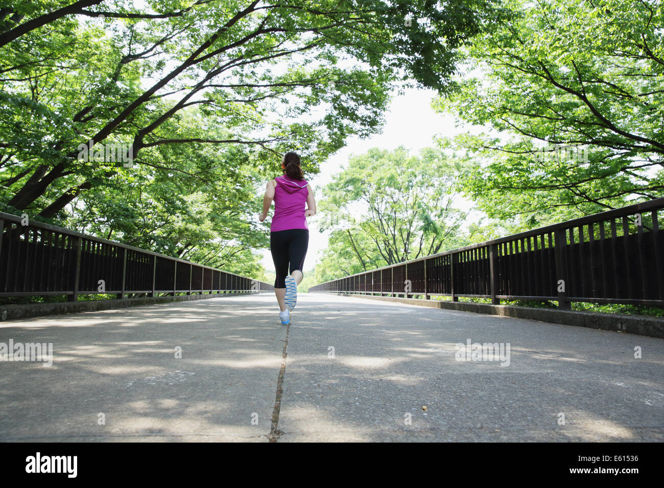 Young Japanese girl running in the park Stock Photo - Alamy