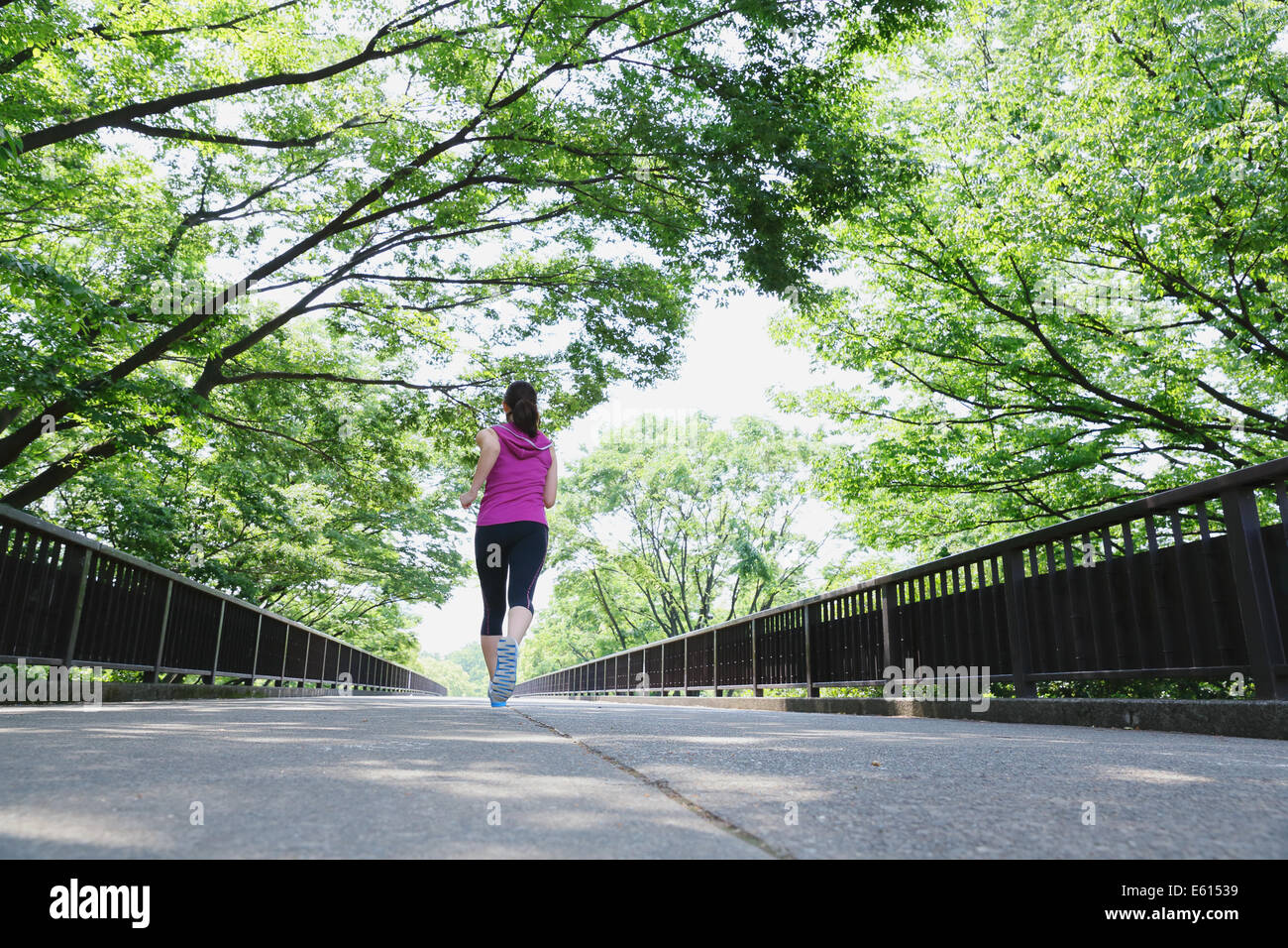 Young Japanese girl running in the park Stock Photo - Alamy