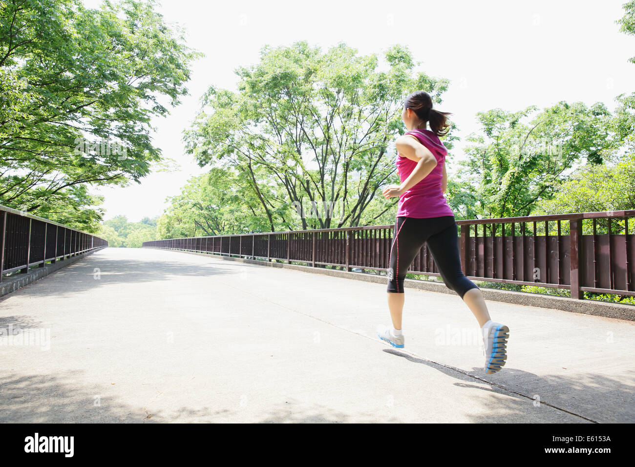 Young Japanese girl running in the park Stock Photo - Alamy