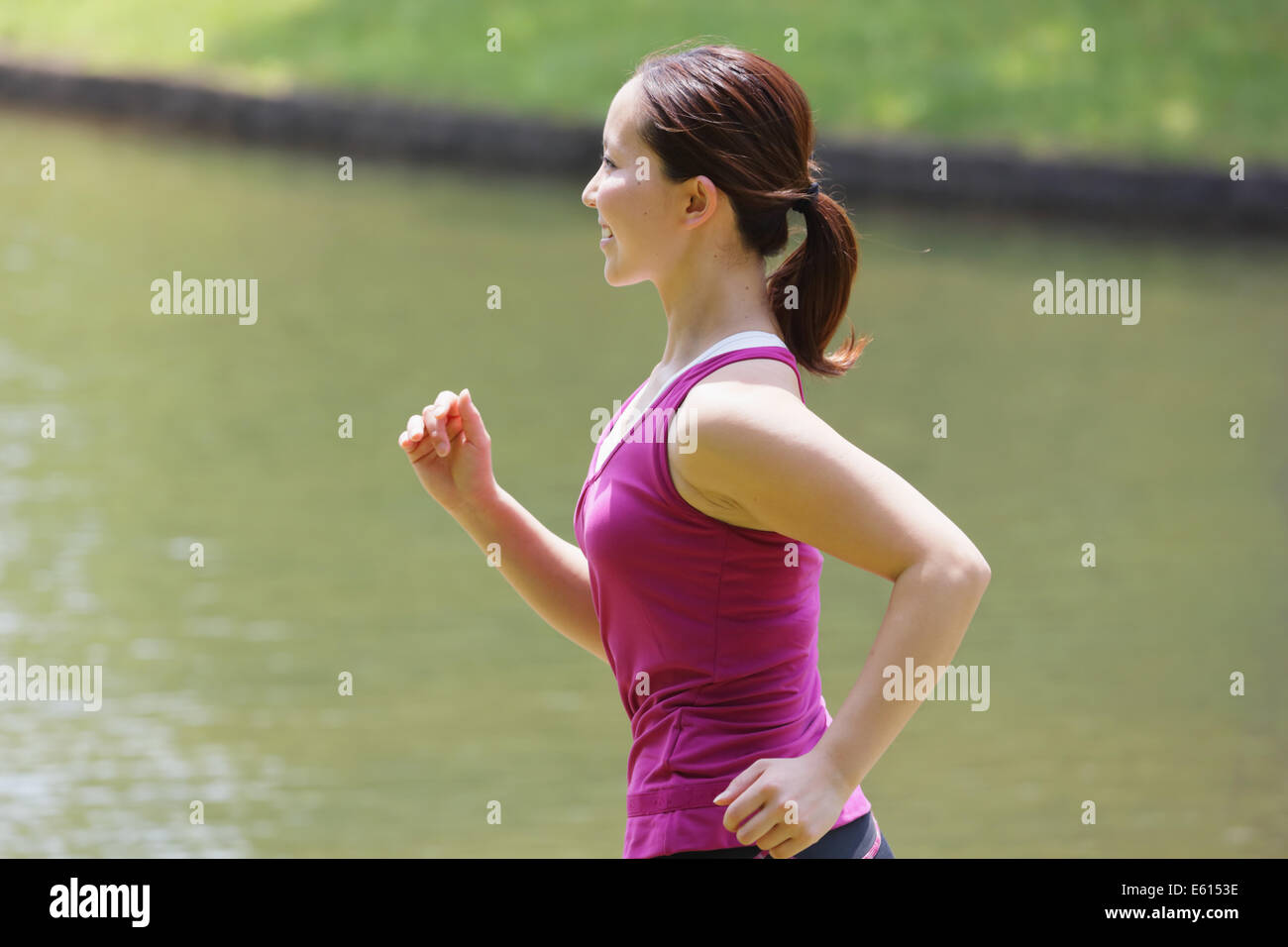 Young Japanese girl running in the park Stock Photo - Alamy