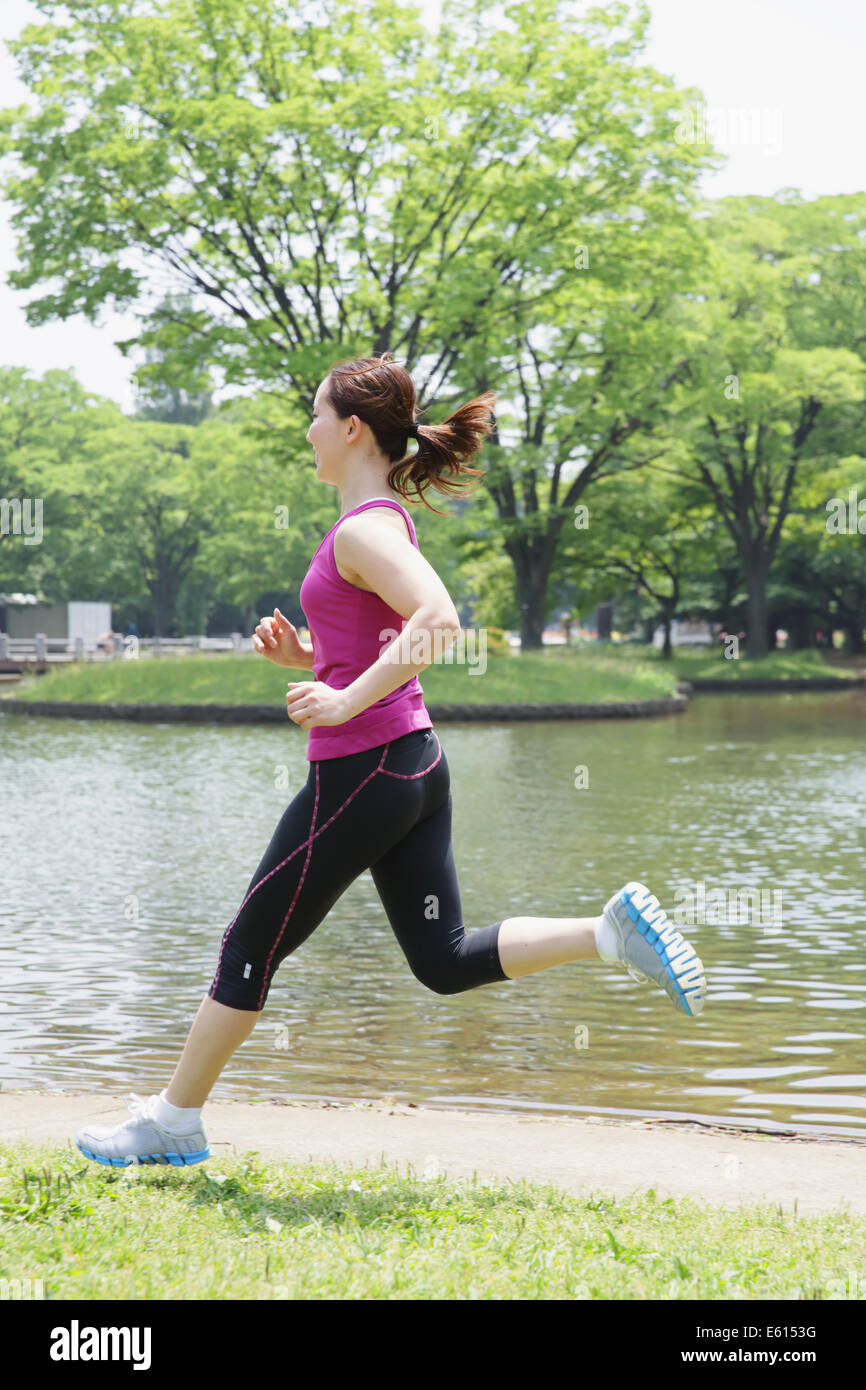 Young Japanese girl running in the park Stock Photo - Alamy