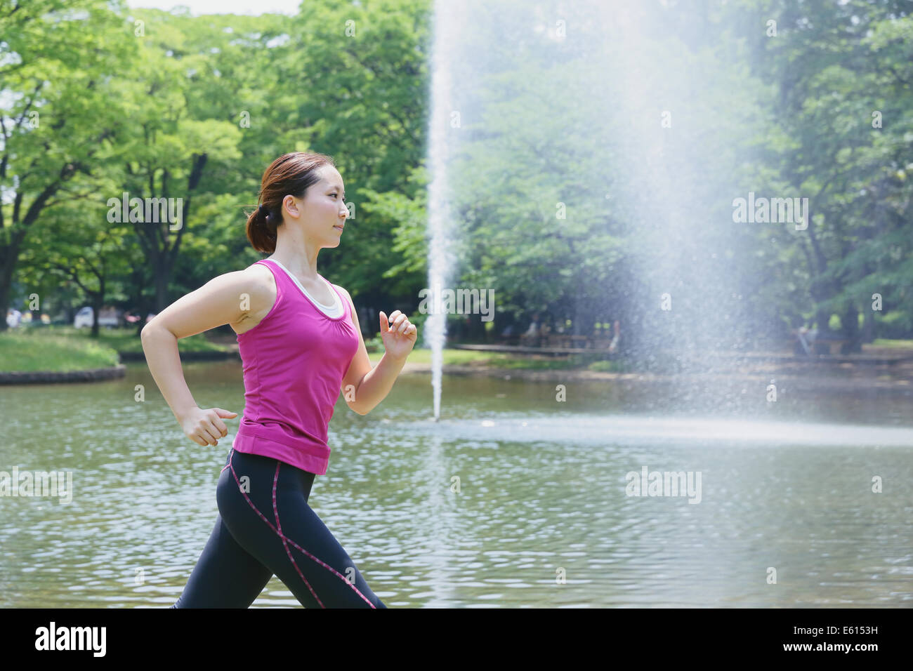 Young Japanese girl running in the park Stock Photo - Alamy