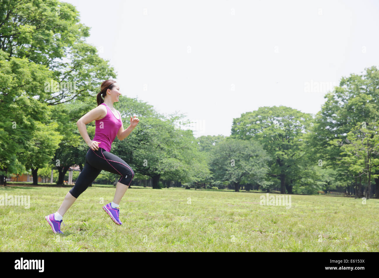 Young Japanese girl running in the park Stock Photo - Alamy