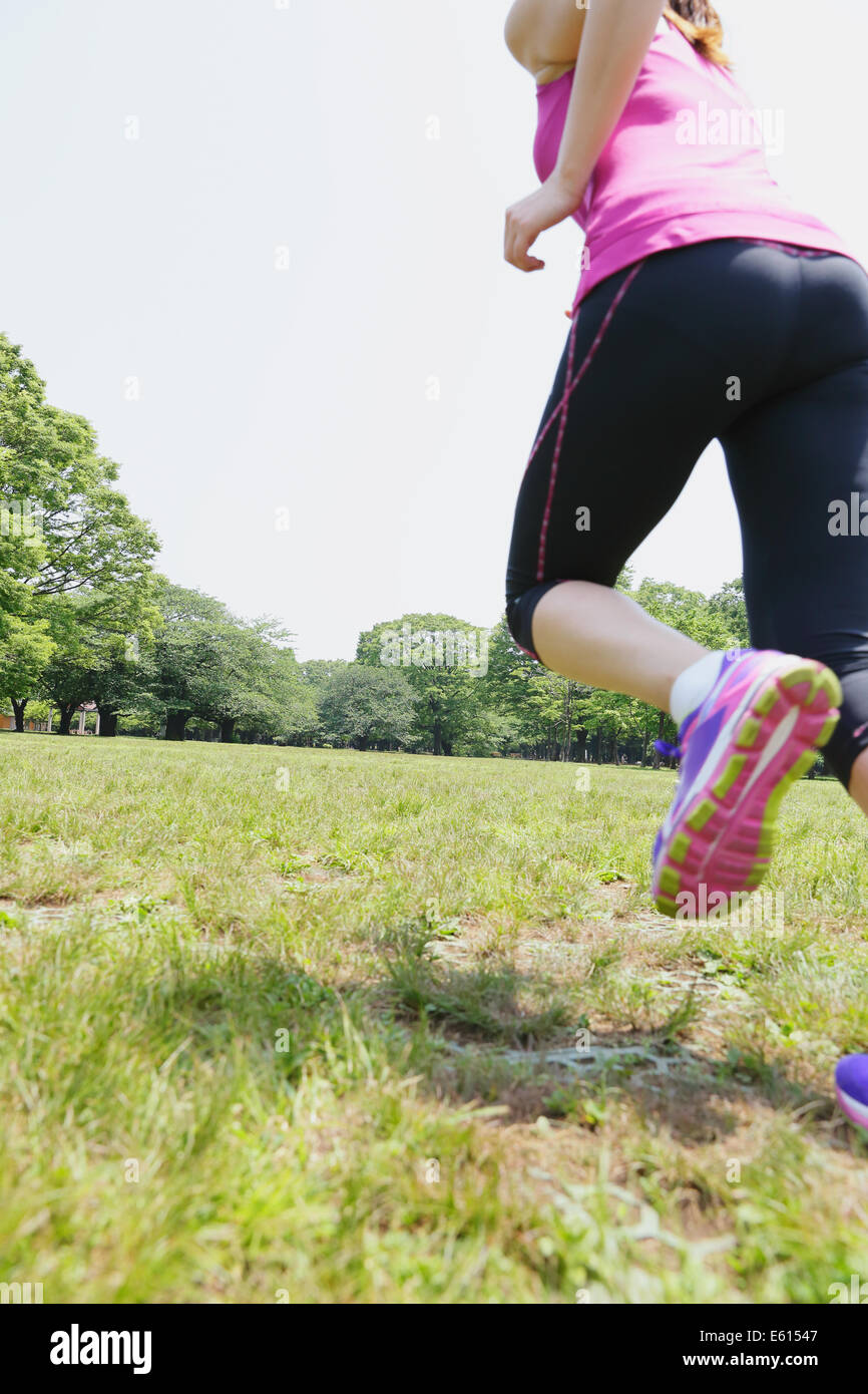 Young Japanese girl running in the park Stock Photo - Alamy