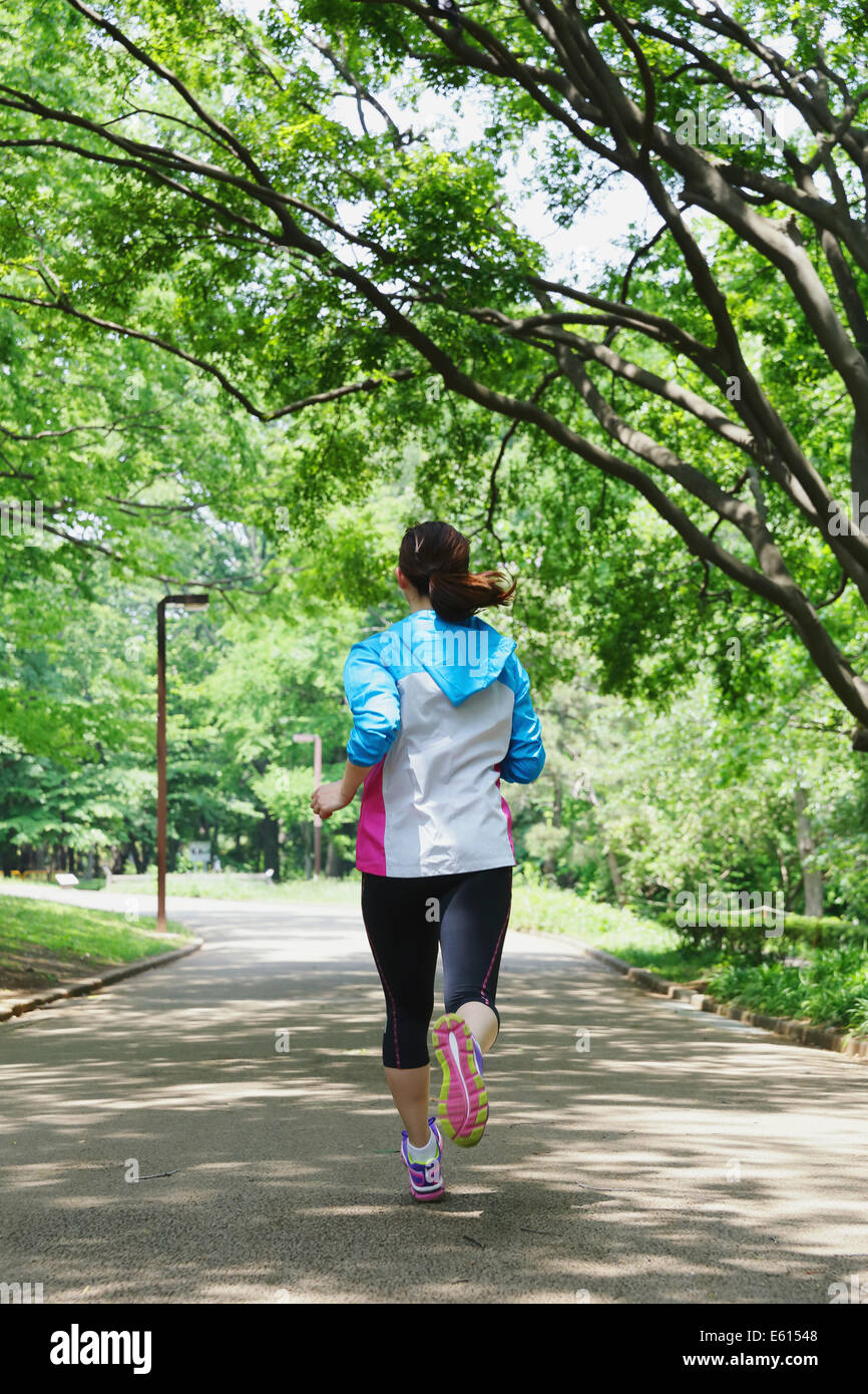 Young Japanese girl running in the park Stock Photo - Alamy