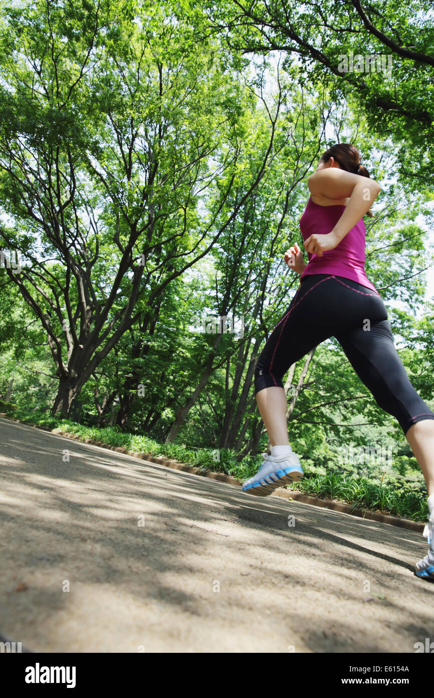Young Japanese girl running in the park Stock Photo - Alamy