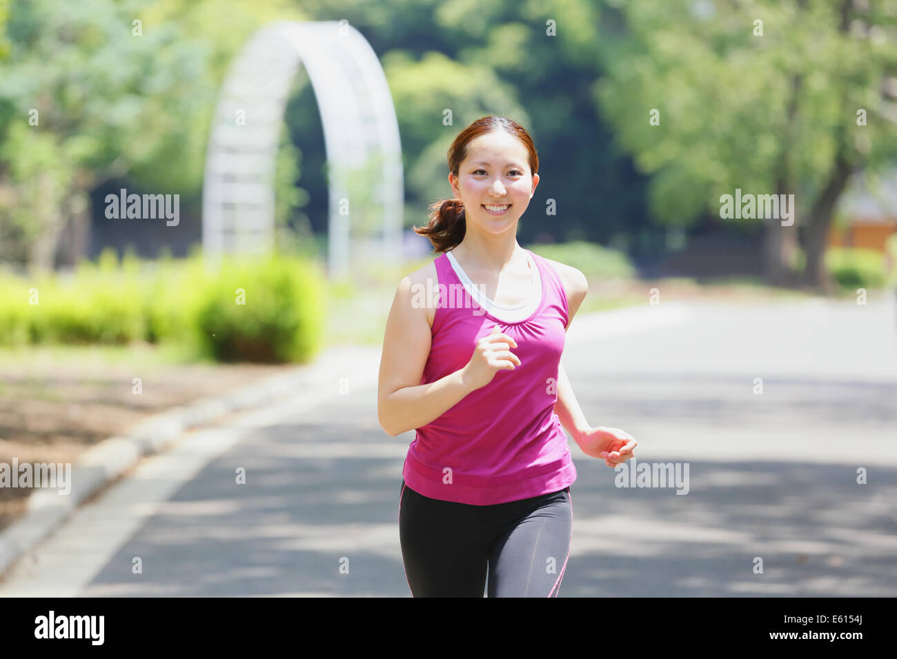 Young Japanese girl running in the park Stock Photo - Alamy