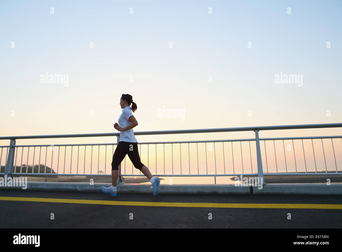 Young Japanese girl jogging Stock Photo - Alamy