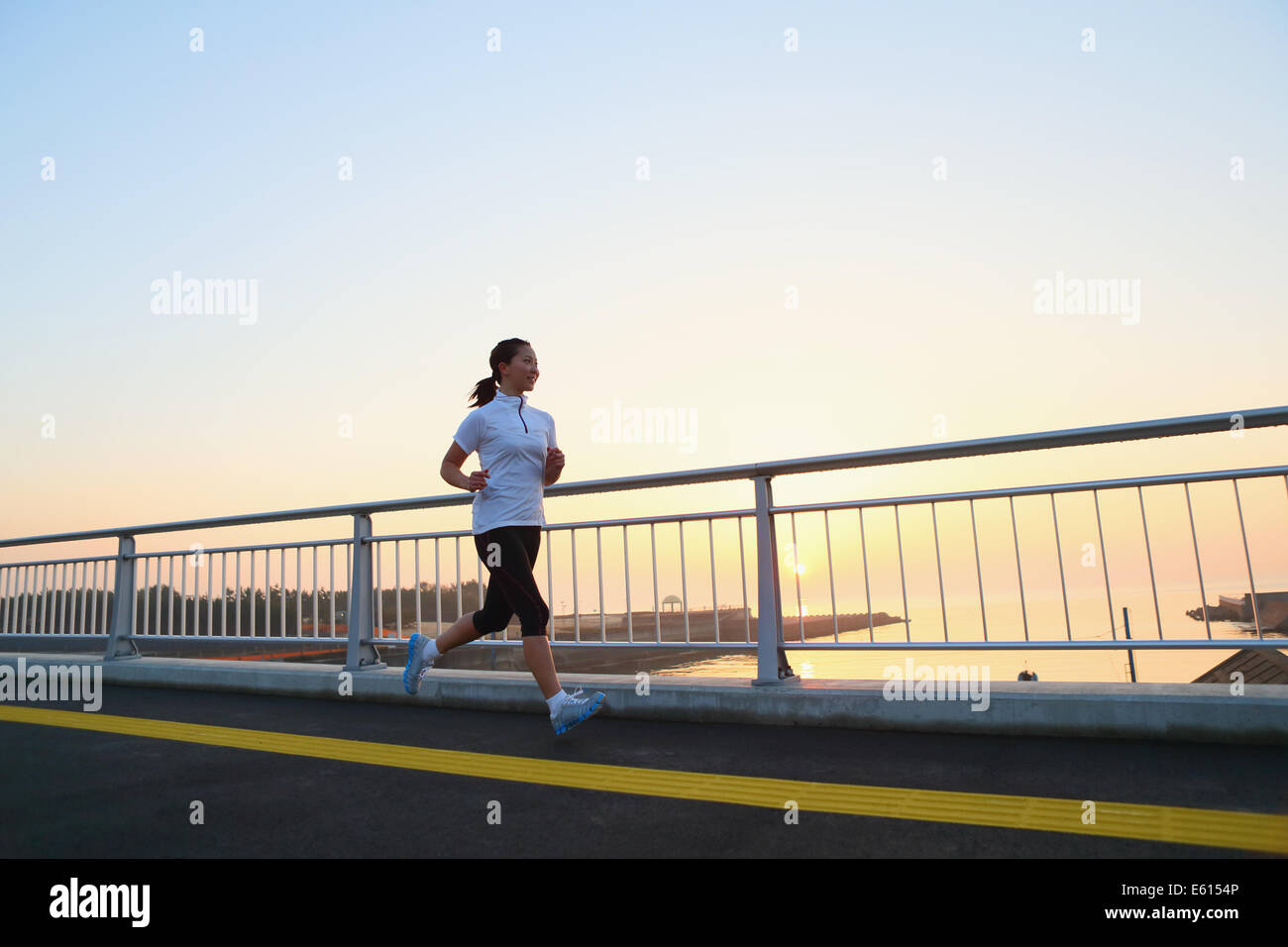 Young Japanese girl jogging Stock Photo - Alamy