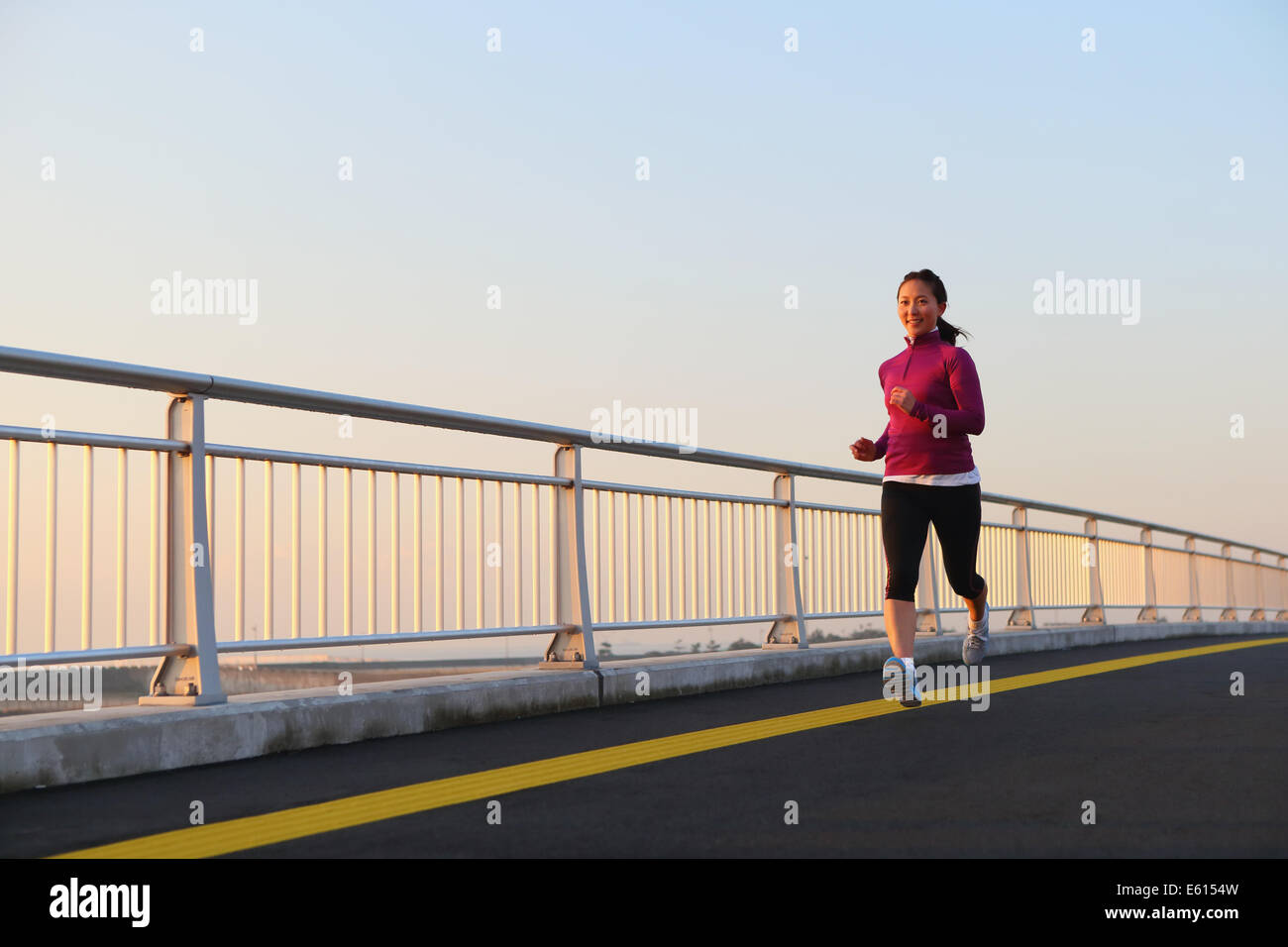 Young Japanese girl jogging Stock Photo - Alamy