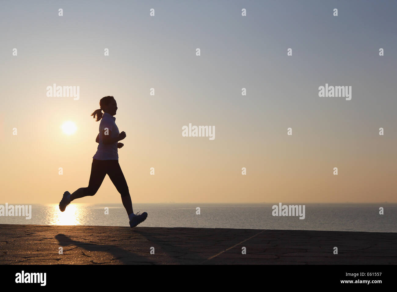 Young Japanese girl jogging Stock Photo - Alamy