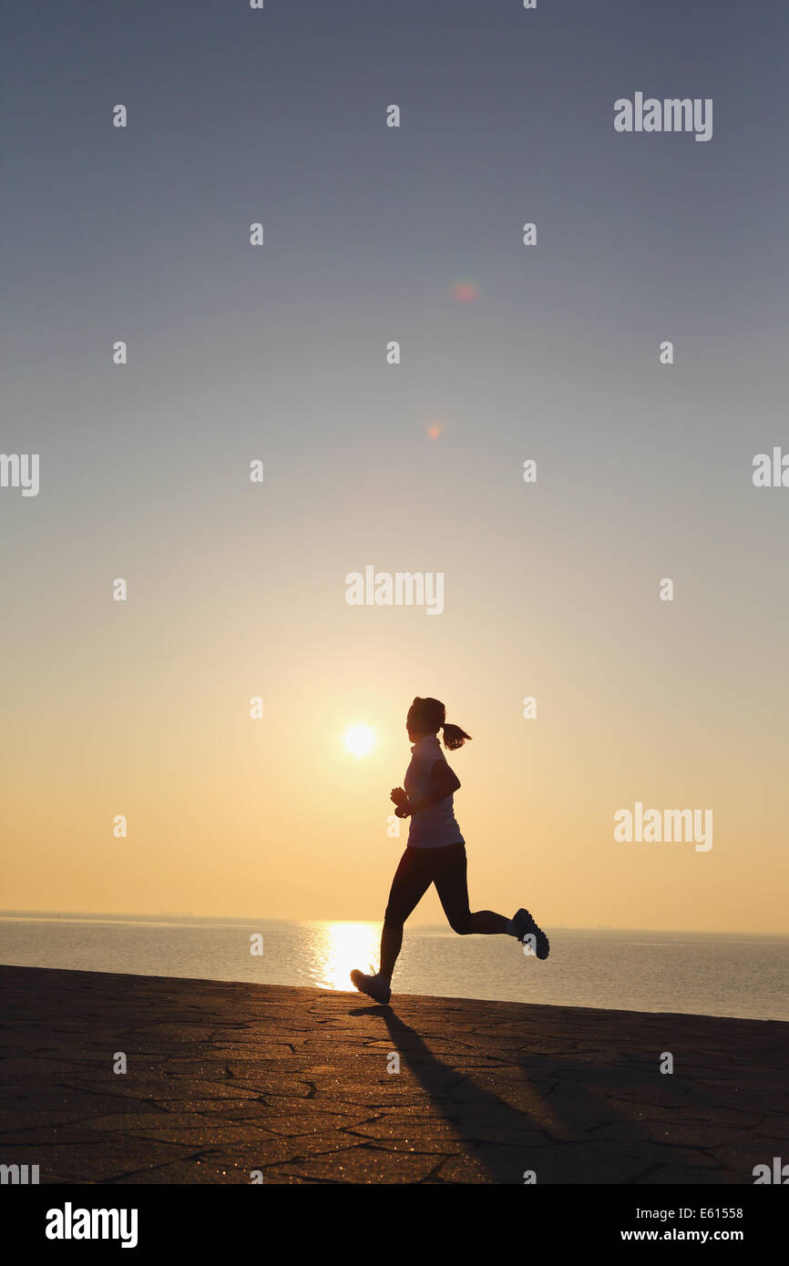 Young Japanese girl jogging Stock Photo - Alamy