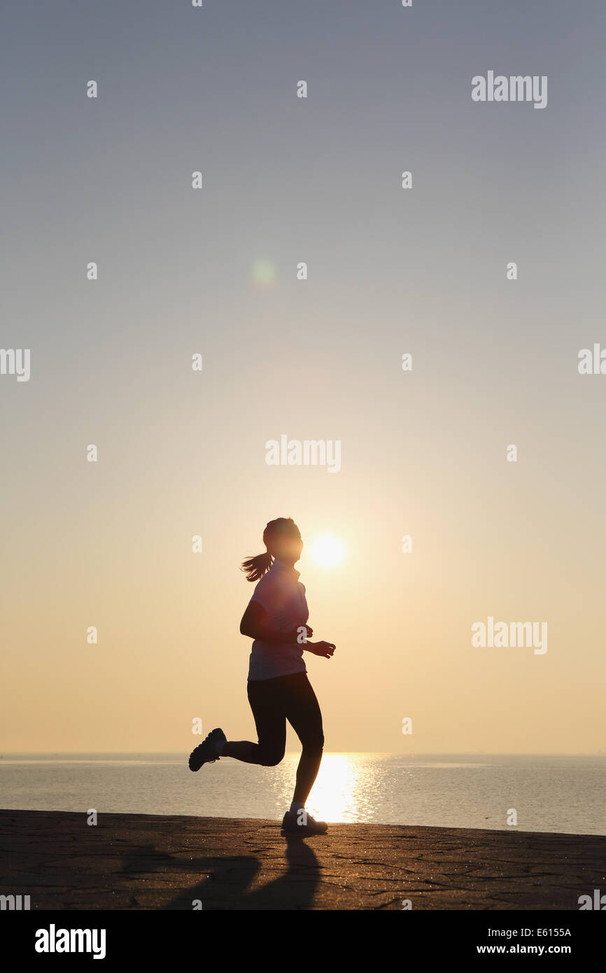 Young Japanese girl jogging Stock Photo - Alamy