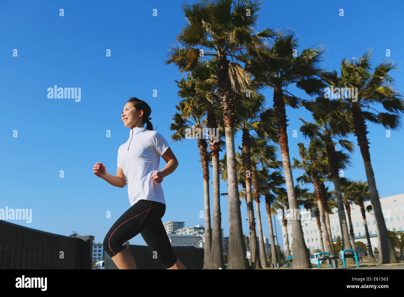Young Japanese girl jogging Stock Photo - Alamy