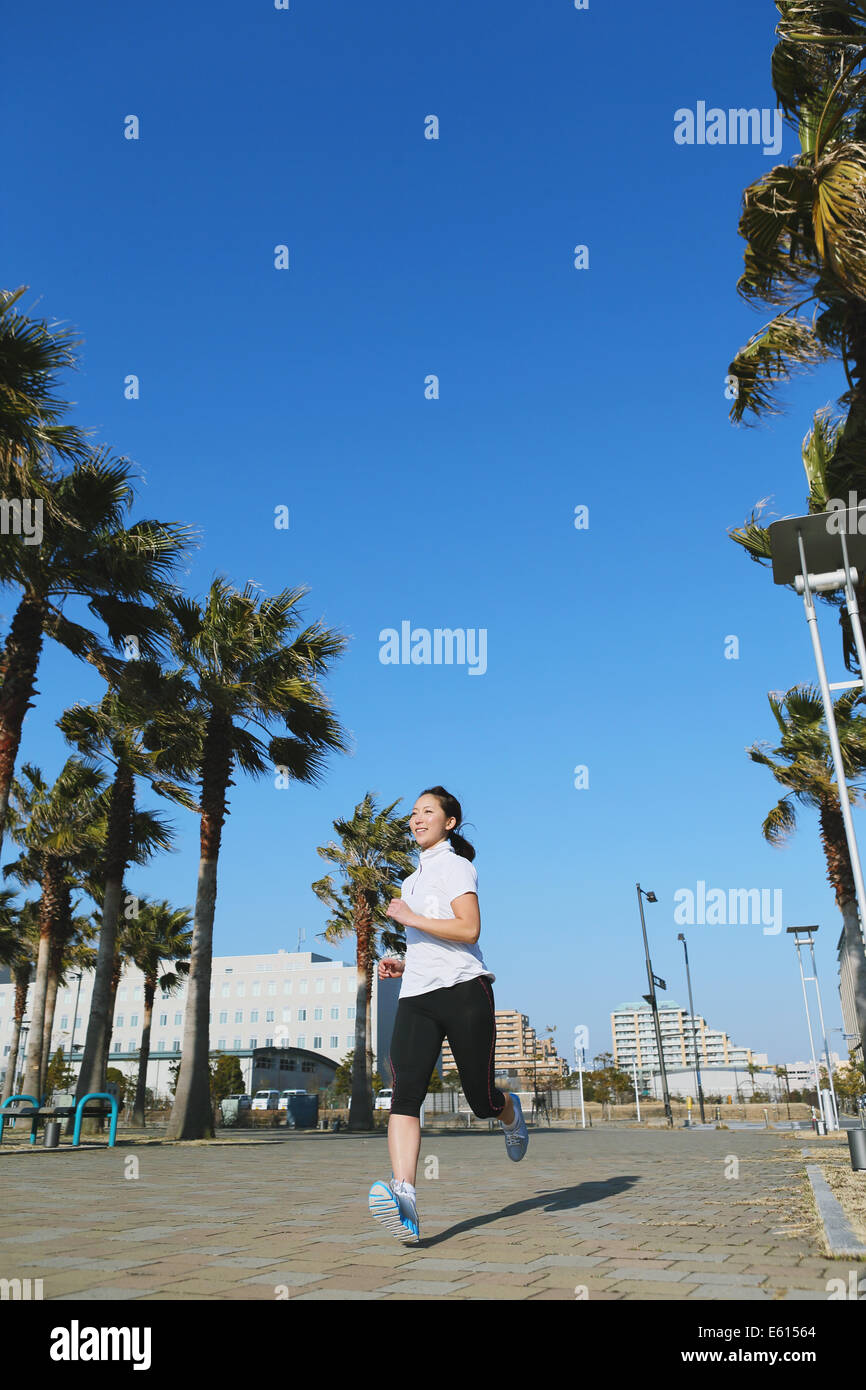 Young Japanese girl jogging Stock Photo - Alamy