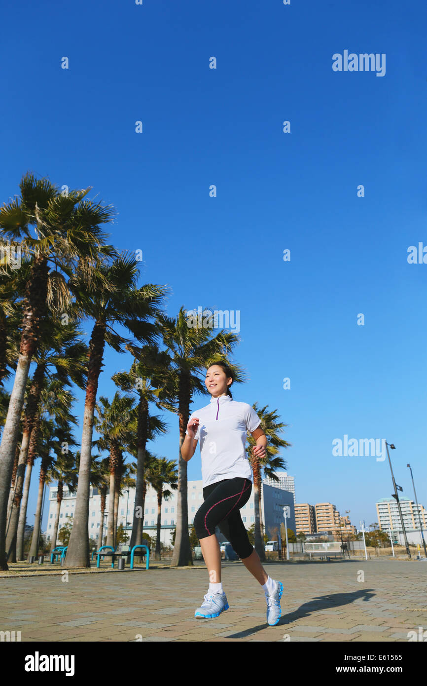 Young Japanese girl jogging Stock Photo - Alamy