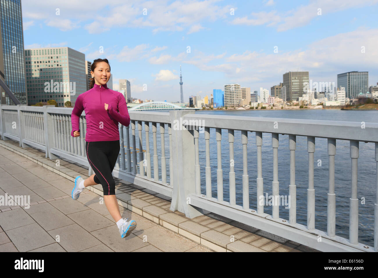 Young Japanese girl jogging Stock Photo - Alamy
