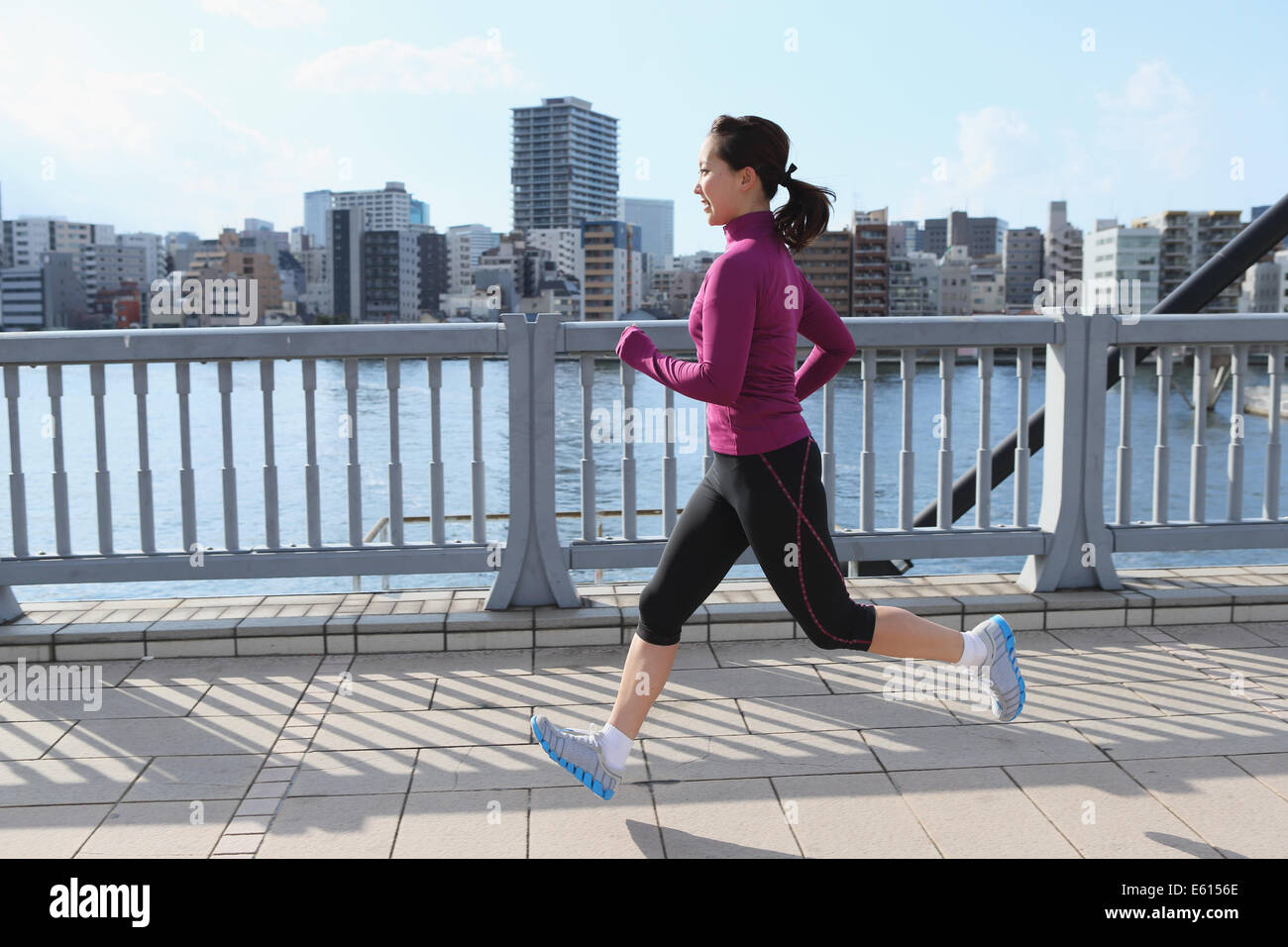 Young Japanese girl jogging Stock Photo - Alamy