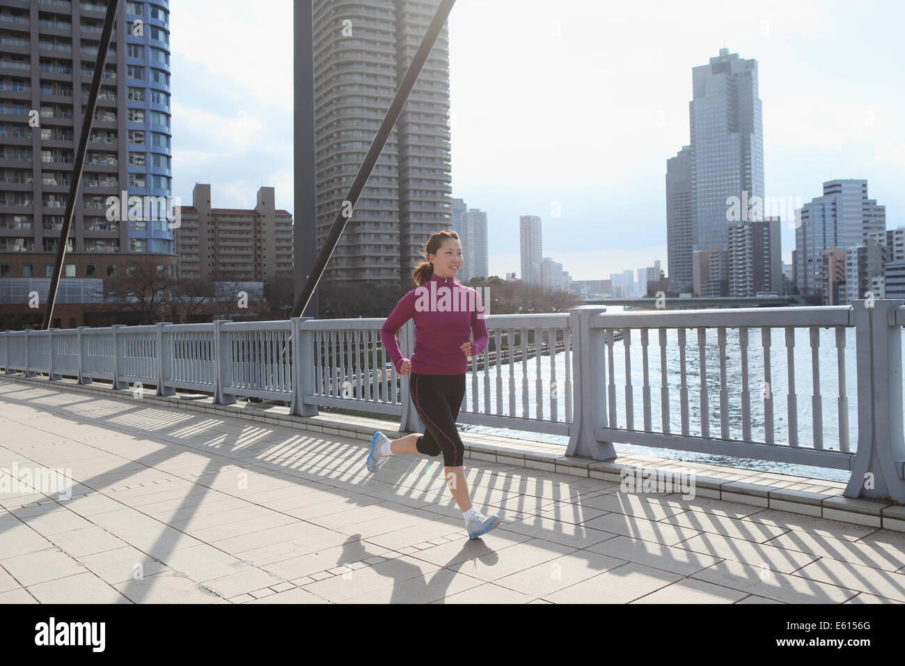 Young Japanese girl jogging Stock Photo - Alamy
