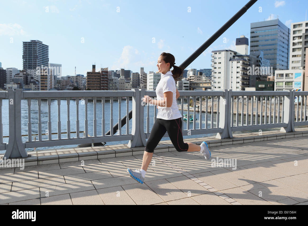 Young Japanese girl jogging Stock Photo - Alamy