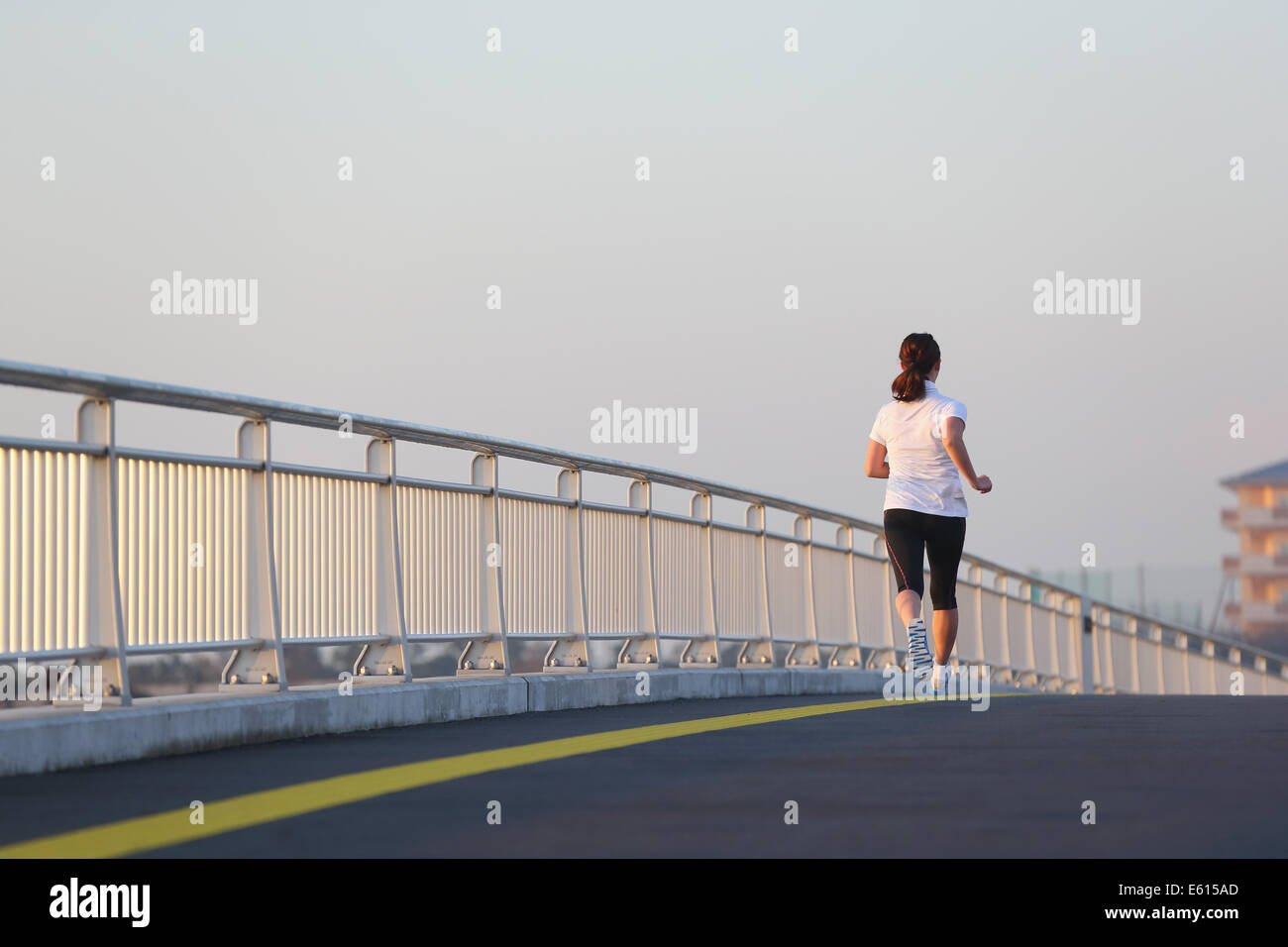 Young Japanese girl jogging Stock Photo - Alamy