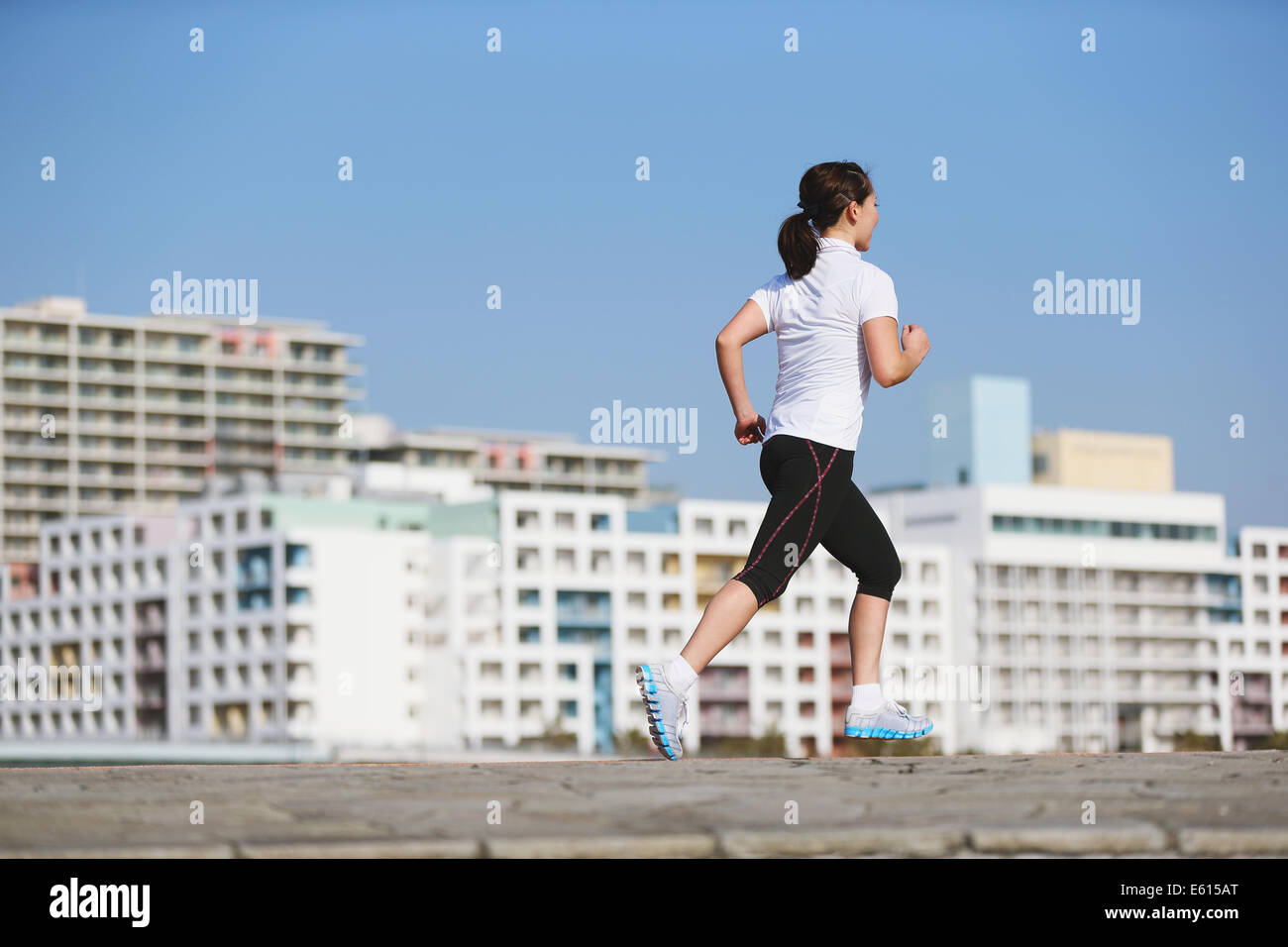 Young Japanese girl jogging Stock Photo - Alamy