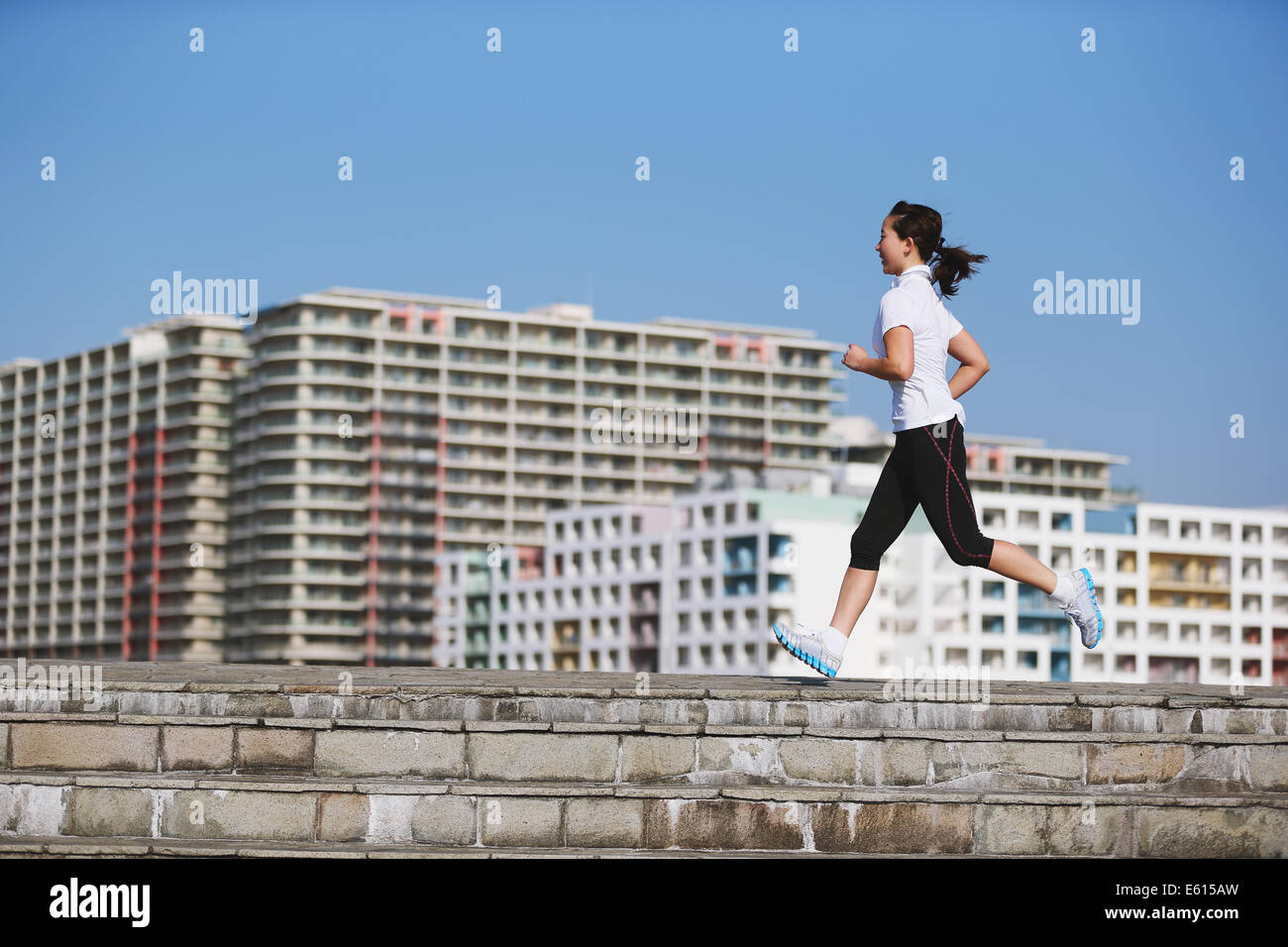 Young Japanese girl jogging Stock Photo - Alamy