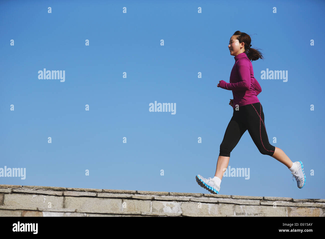 Young Japanese girl jogging Stock Photo - Alamy