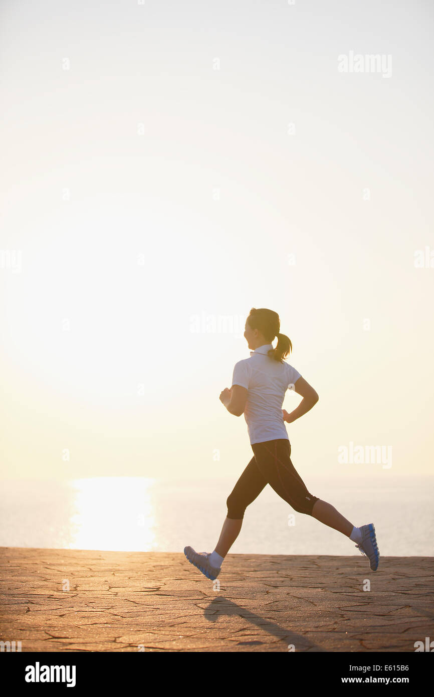 Young Japanese girl jogging Stock Photo - Alamy