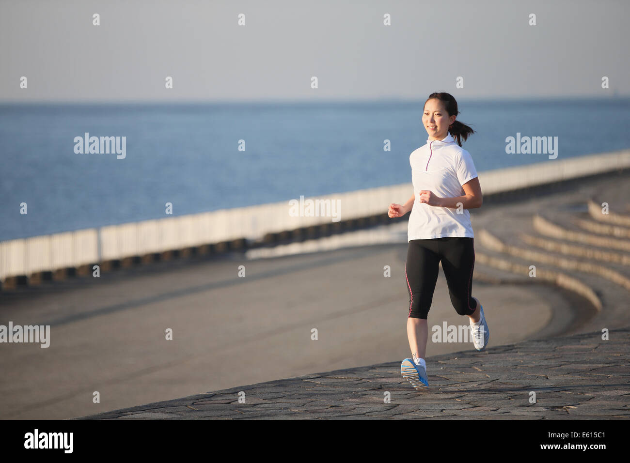 Young Japanese girl jogging Stock Photo - Alamy