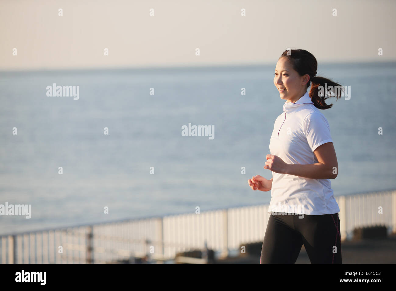 Young Japanese girl jogging Stock Photo - Alamy