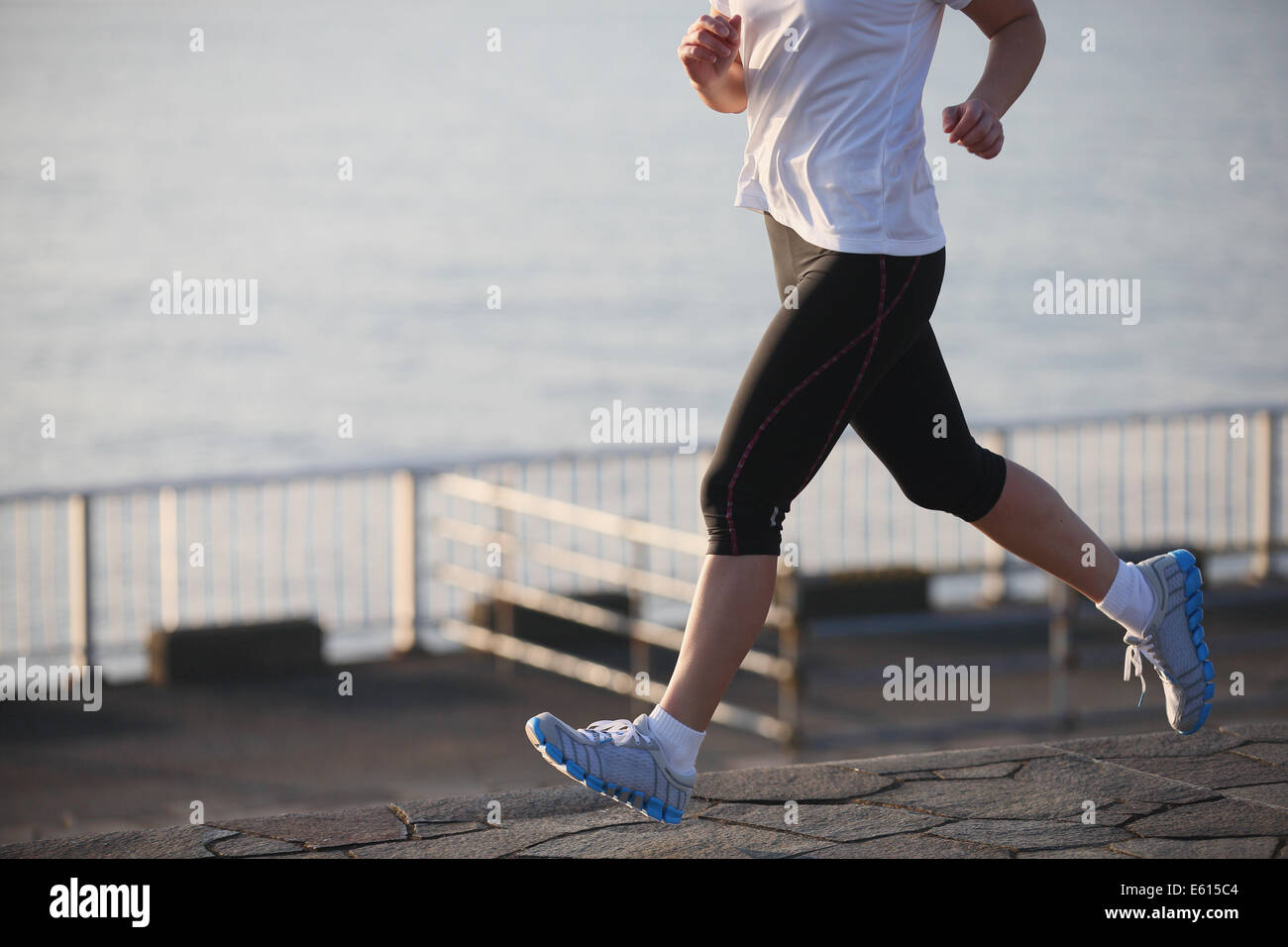 Young Japanese girl jogging Stock Photo - Alamy