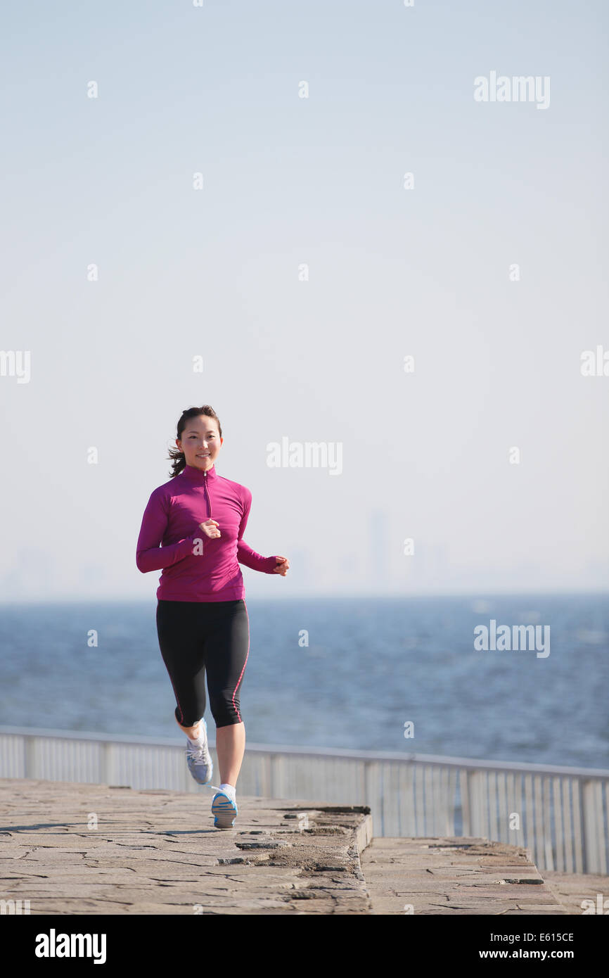 Young Japanese girl jogging Stock Photo - Alamy
