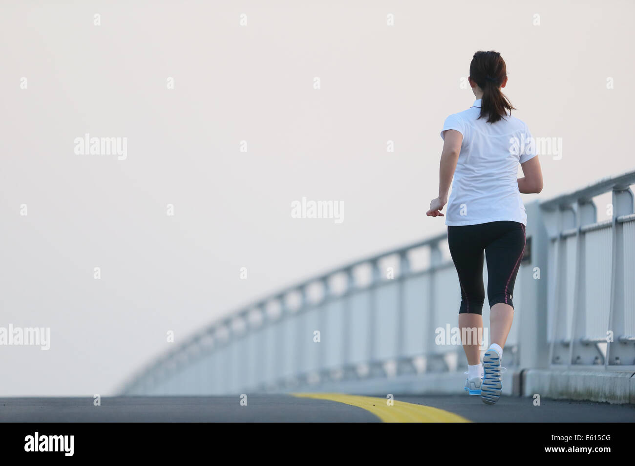 Young Japanese girl jogging Stock Photo - Alamy