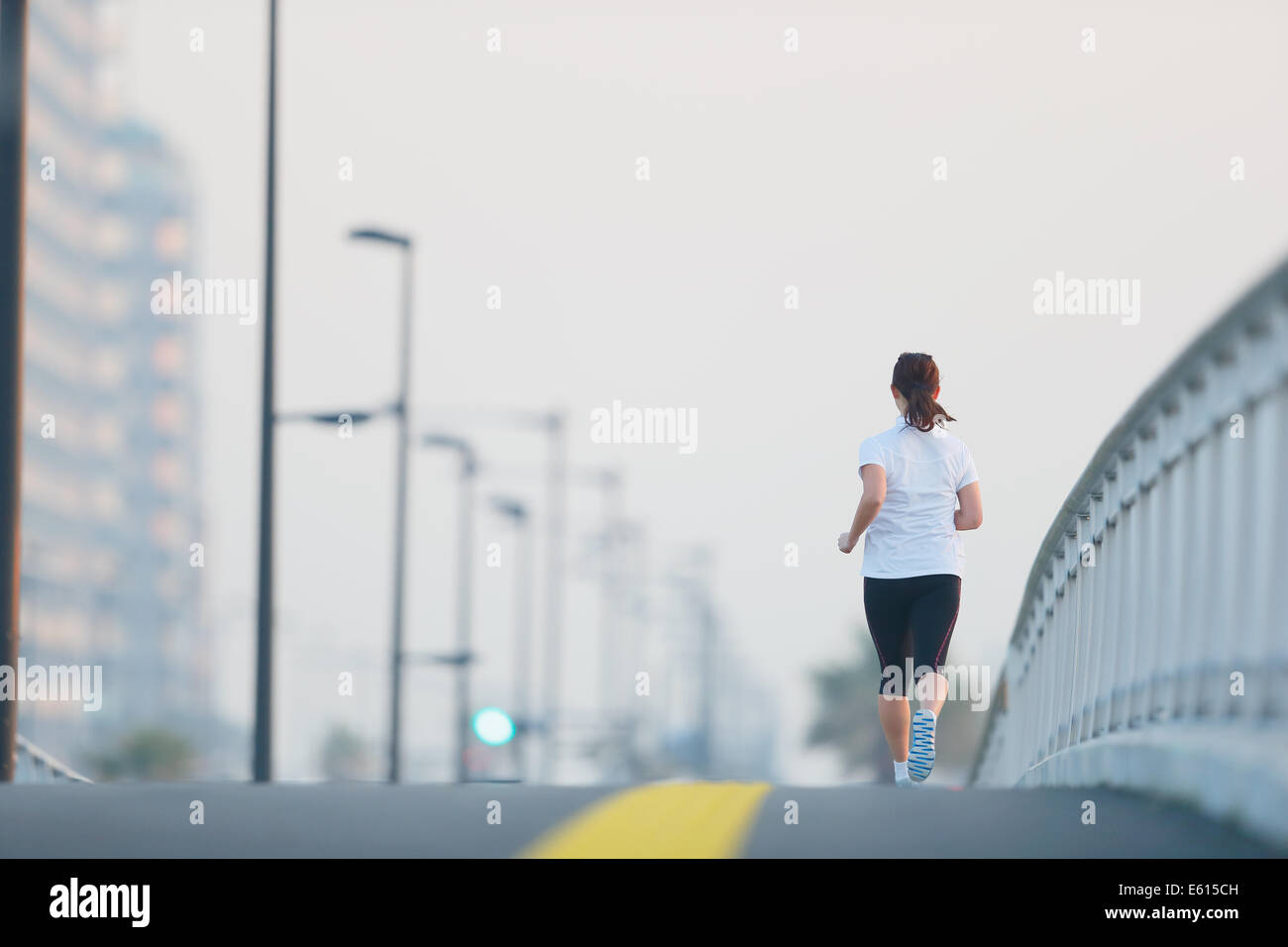 Young Japanese girl jogging Stock Photo - Alamy